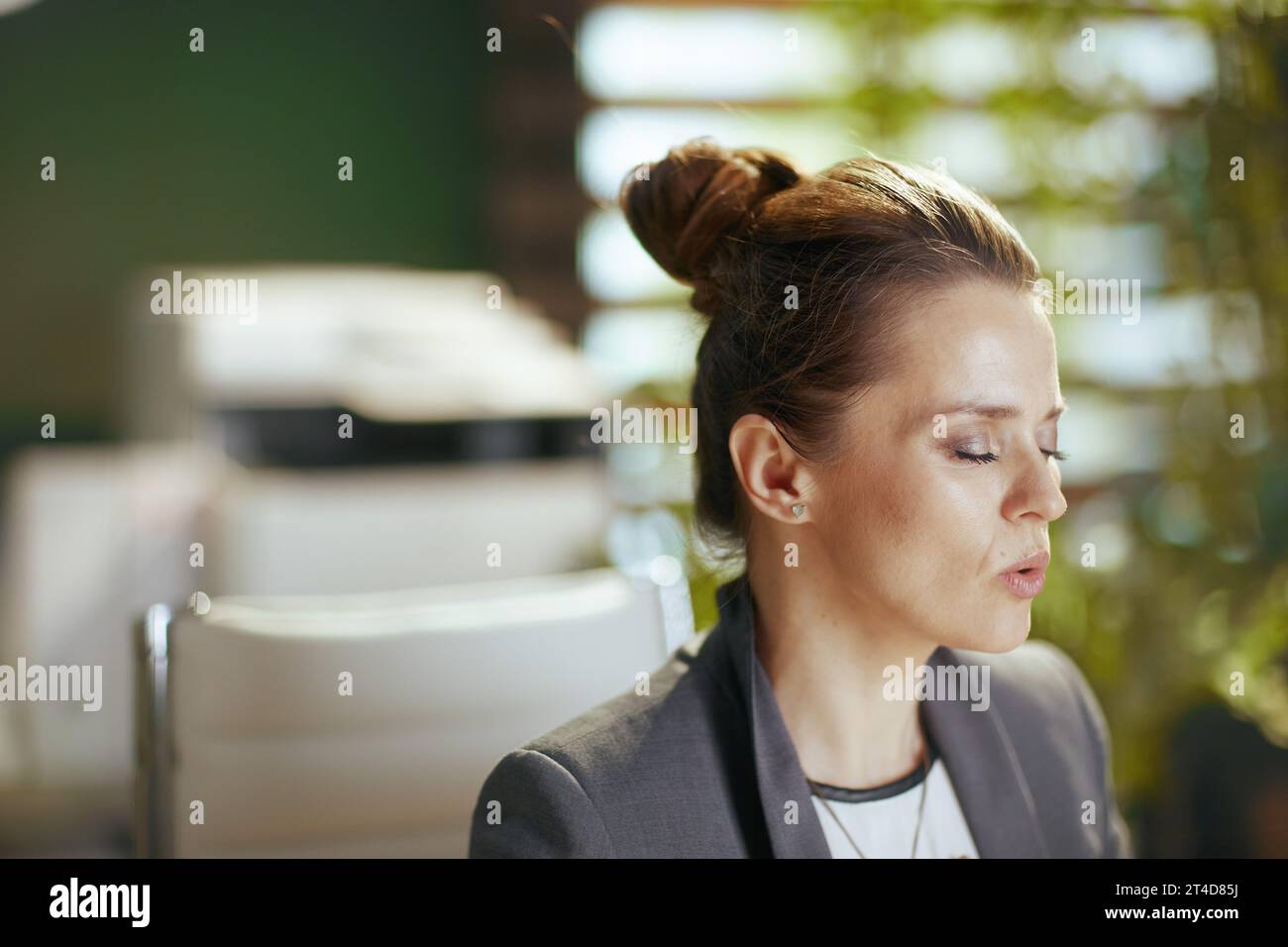 Sustainable workplace. relaxed modern small business owner woman in ...