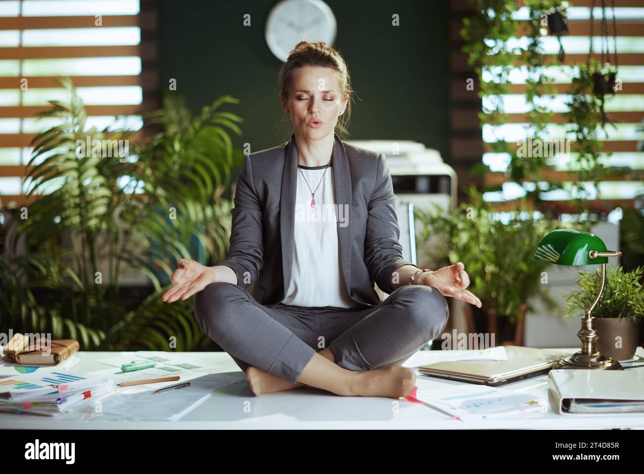 Sustainable workplace. relaxed modern small business owner woman in ...