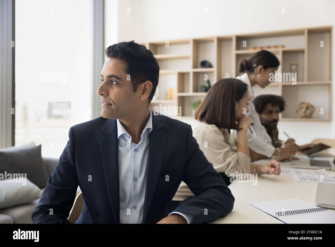 Thoughtful middle aged Indian businessman, CEO, company owner candid ...
