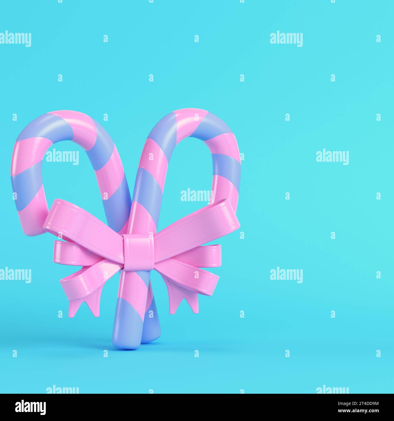 Pink two candy cane with a bow on bright blue background in pastel ...