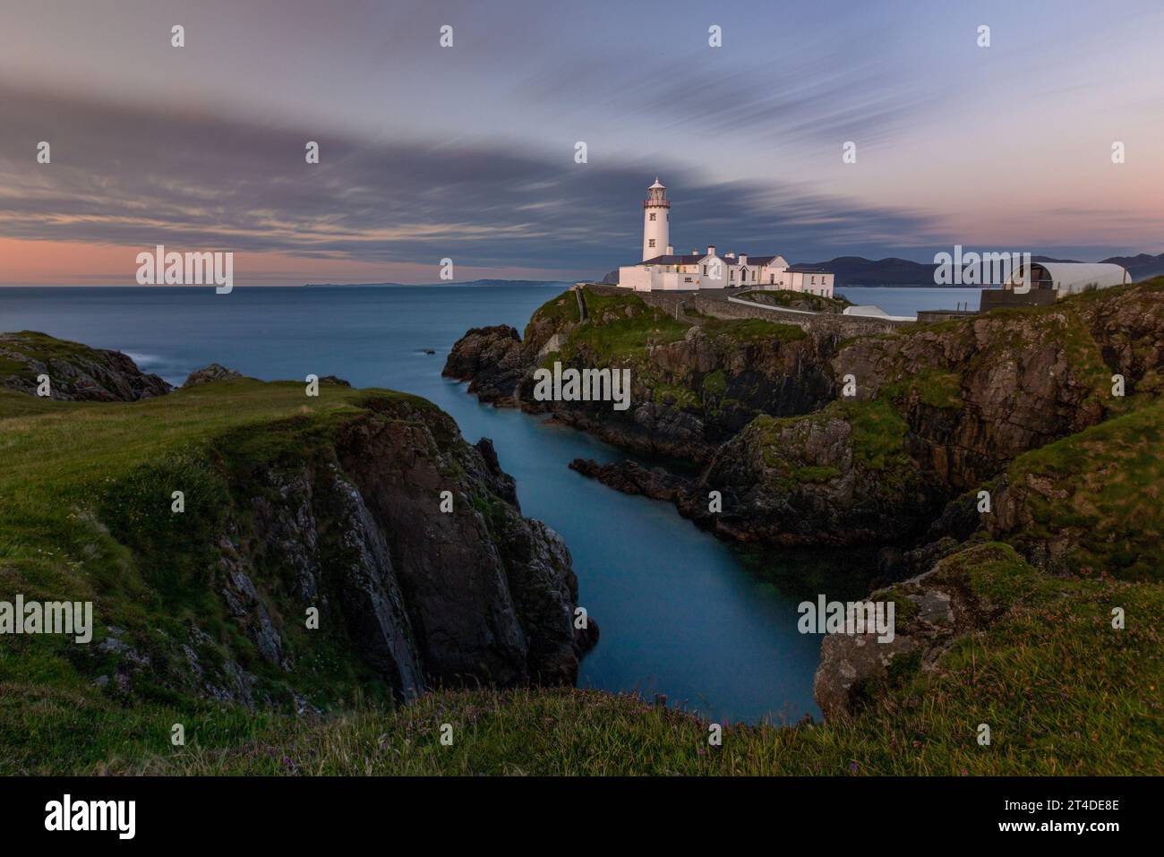 Fanad Head Lighthouse is a 22-meter-tall whitewashed stone tower with a ...