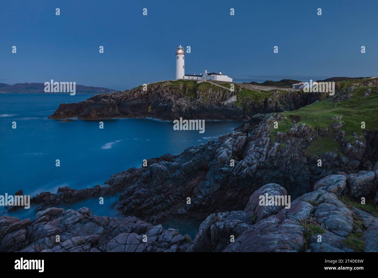 Fanad Head Lighthouse is a 22-meter-tall whitewashed stone tower with a ...