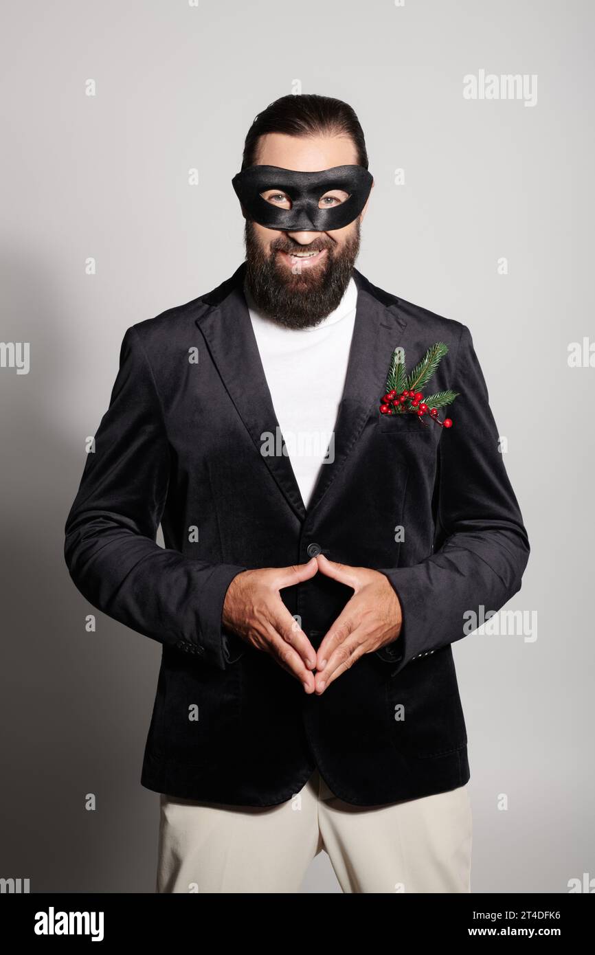 Masquerade ball, cheerful bearded man in carnival mask and elegant ...