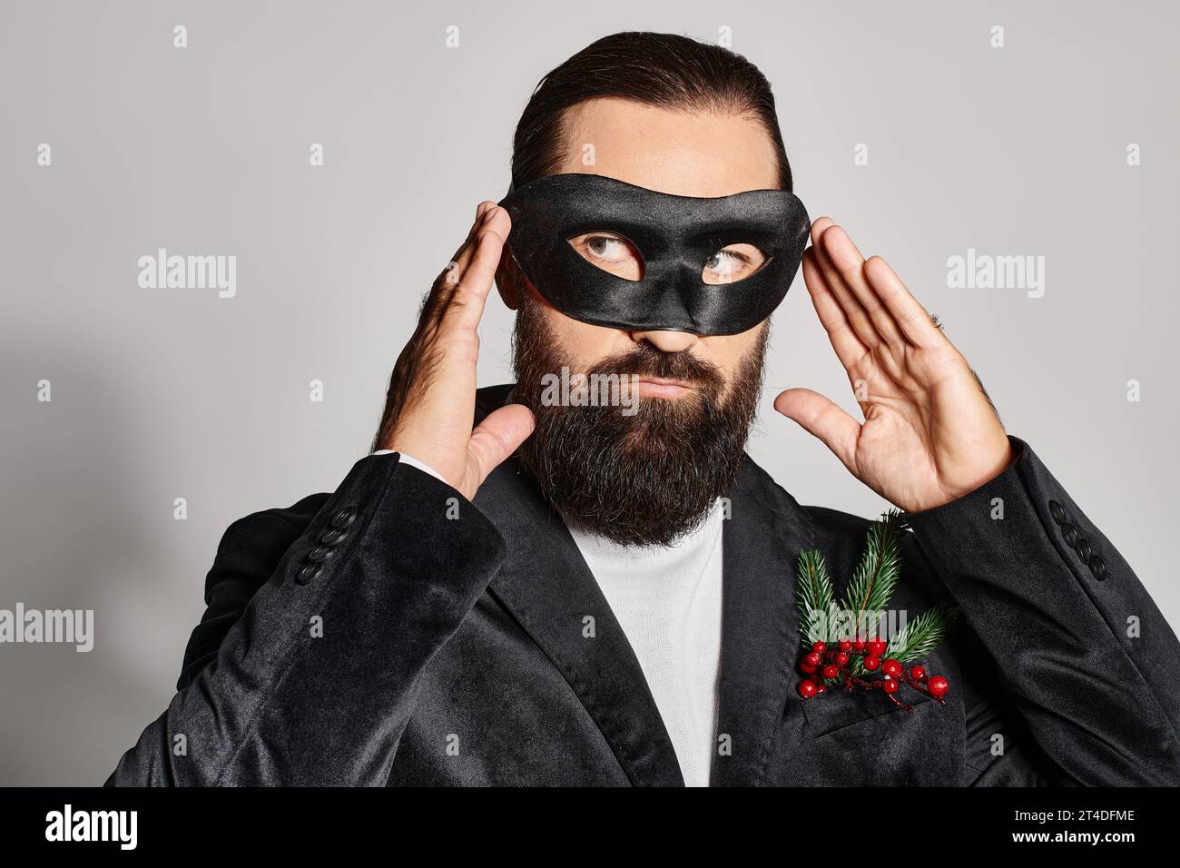 Masquerade, handsome bearded man in carnival mask and elegant formal ...