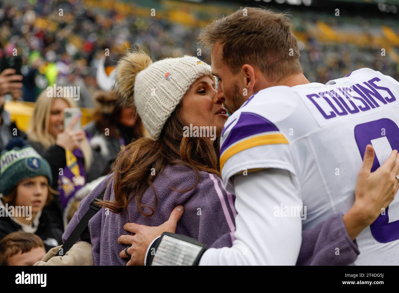 Minnesota Vikings quarterback Kirk Cousins (8) kisses his wife before ...