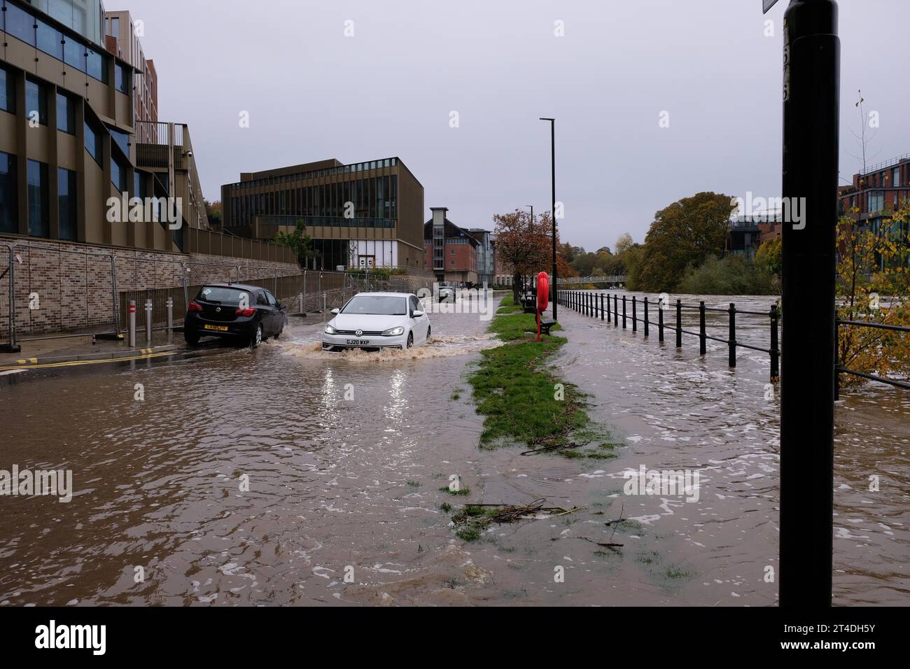 Cars pass through flood water as the River Wear burst its banks and ...
