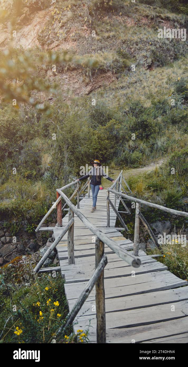 traveler hipster girl in hat with backpack exploring Pisac ...