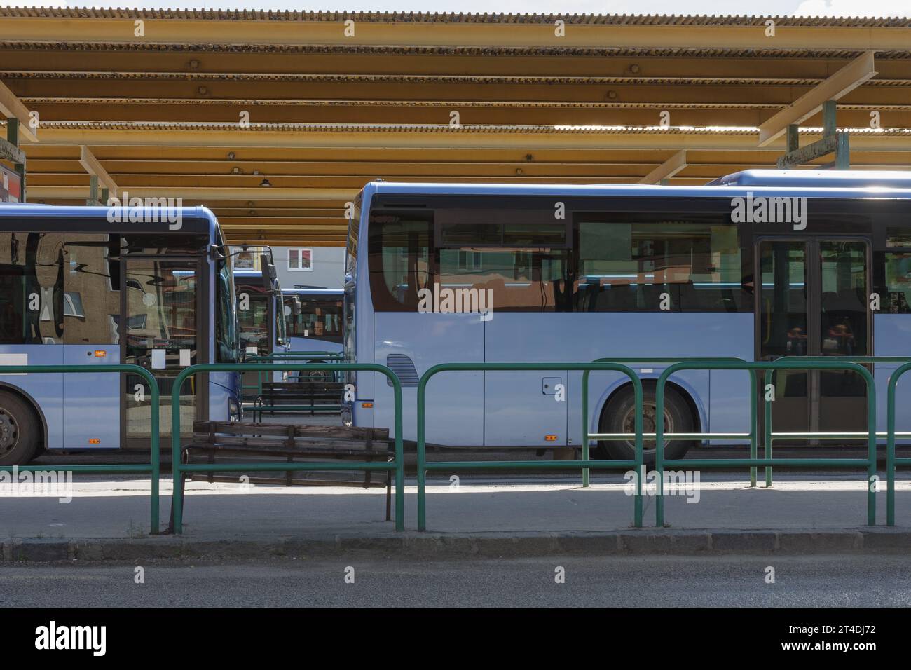 Blue buses parking, waiting for passengers on bus station. The station ...