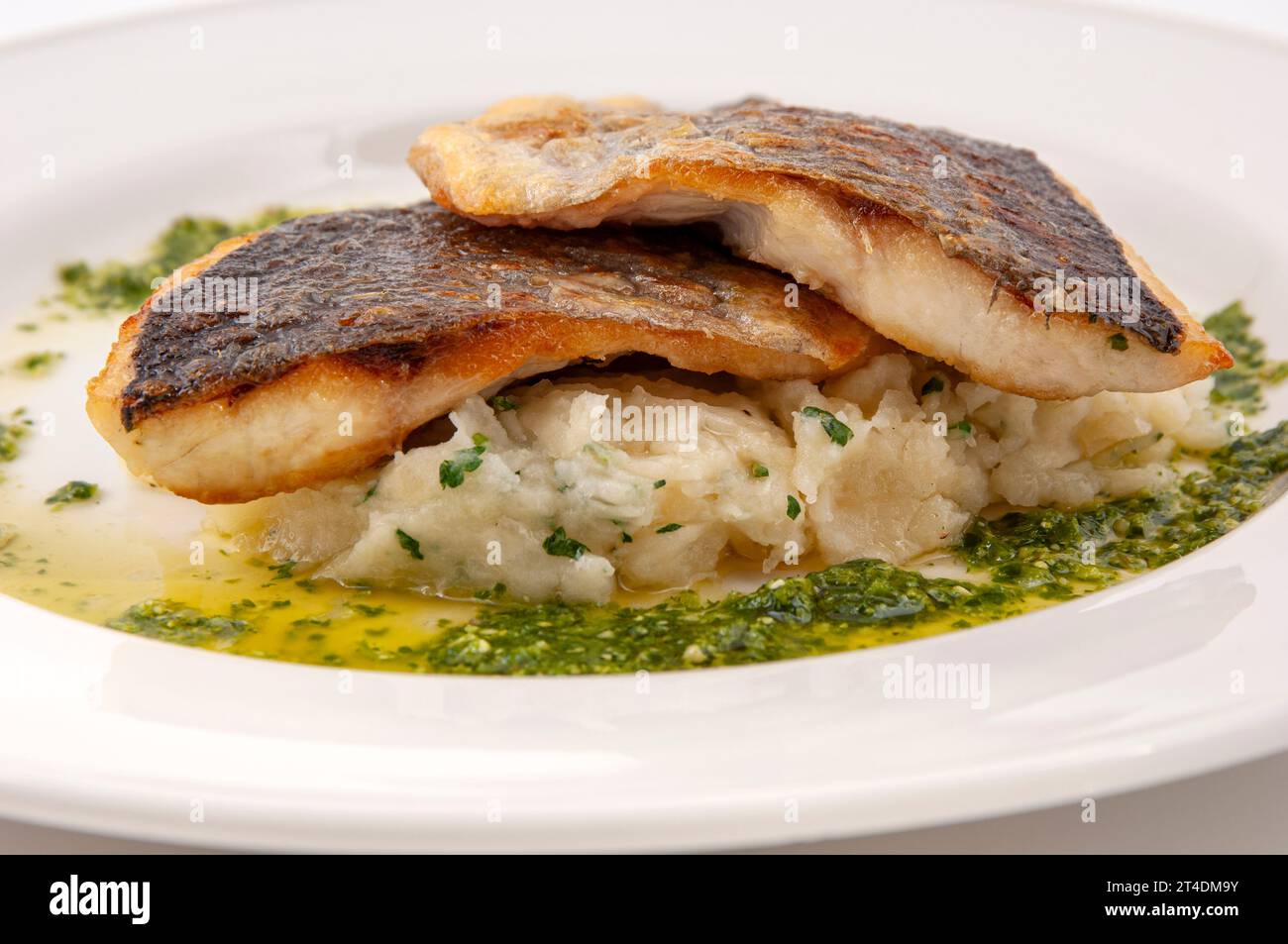 Fried fish with lemony mashed potato Stock Photo - Alamy