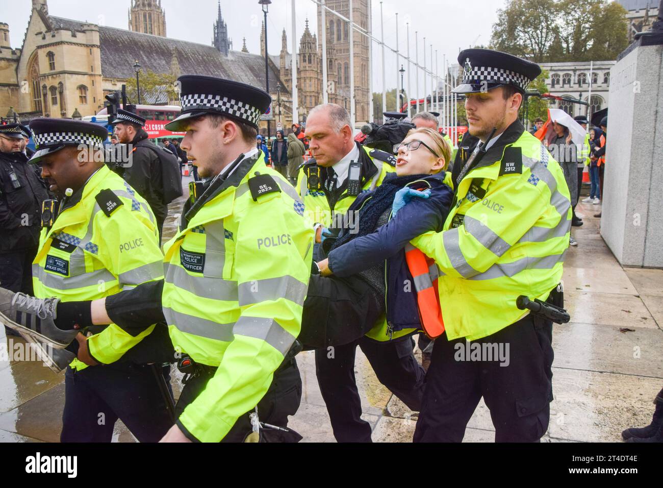 London, UK. 30th Oct, 2023. Police officers arrest a protester during ...