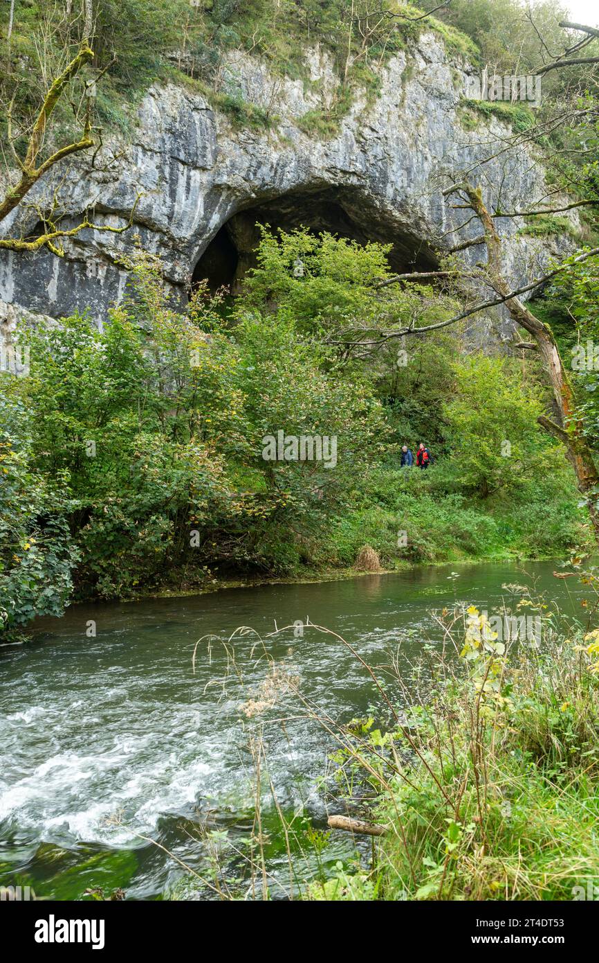 The River Dove with Dove Holes caves in Dovedale valley, Peak District ...