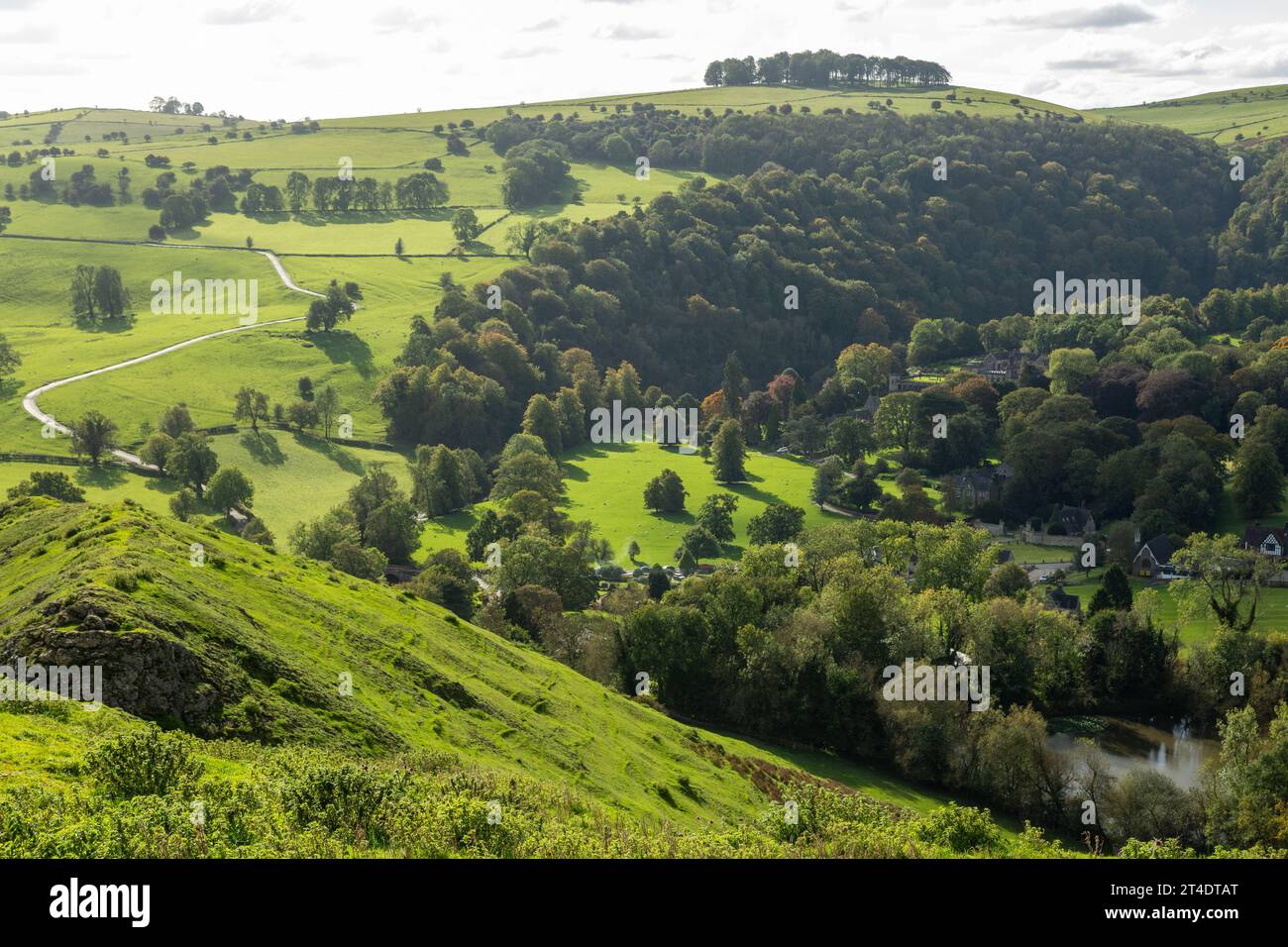 Ilam village in the Staffordshire Peak District with the Hazelton Clump ...