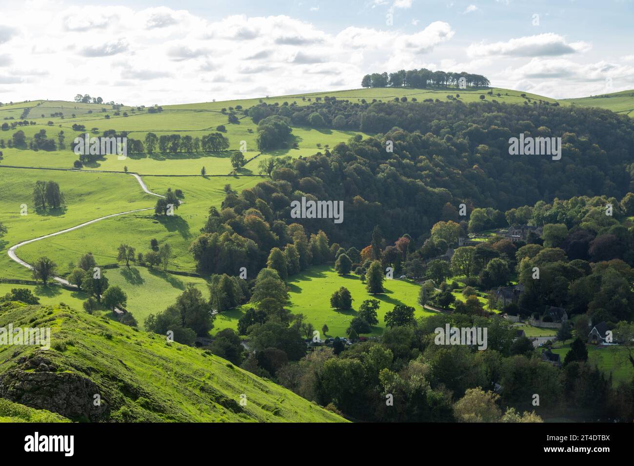 Ilam village in the Staffordshire Peak District with the Hazelton Clump ...