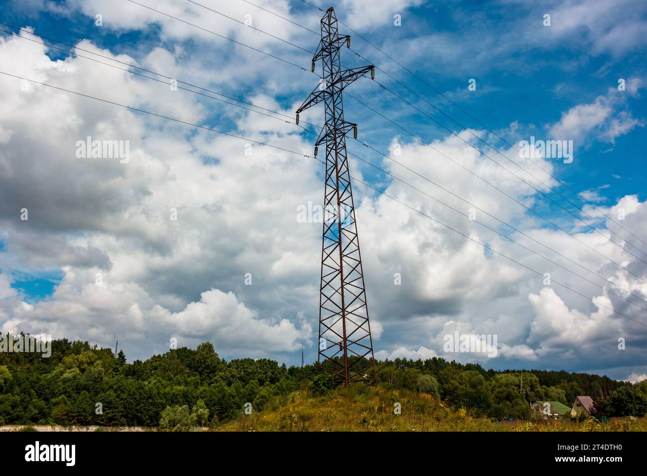 High voltage power line support with electrical wires in rural area ...