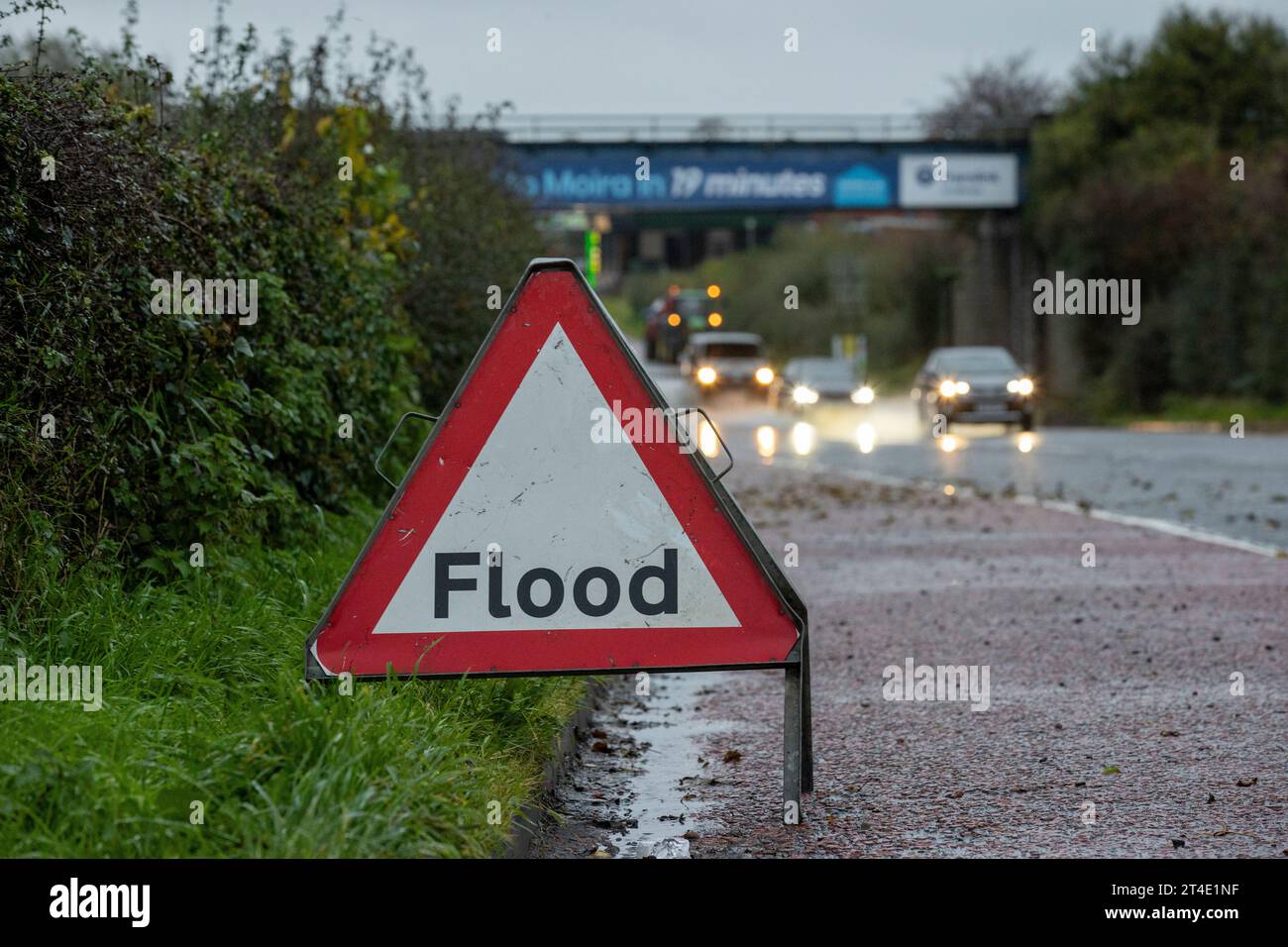 A road sign advising drivers of flooding on the A26 outside the village ...