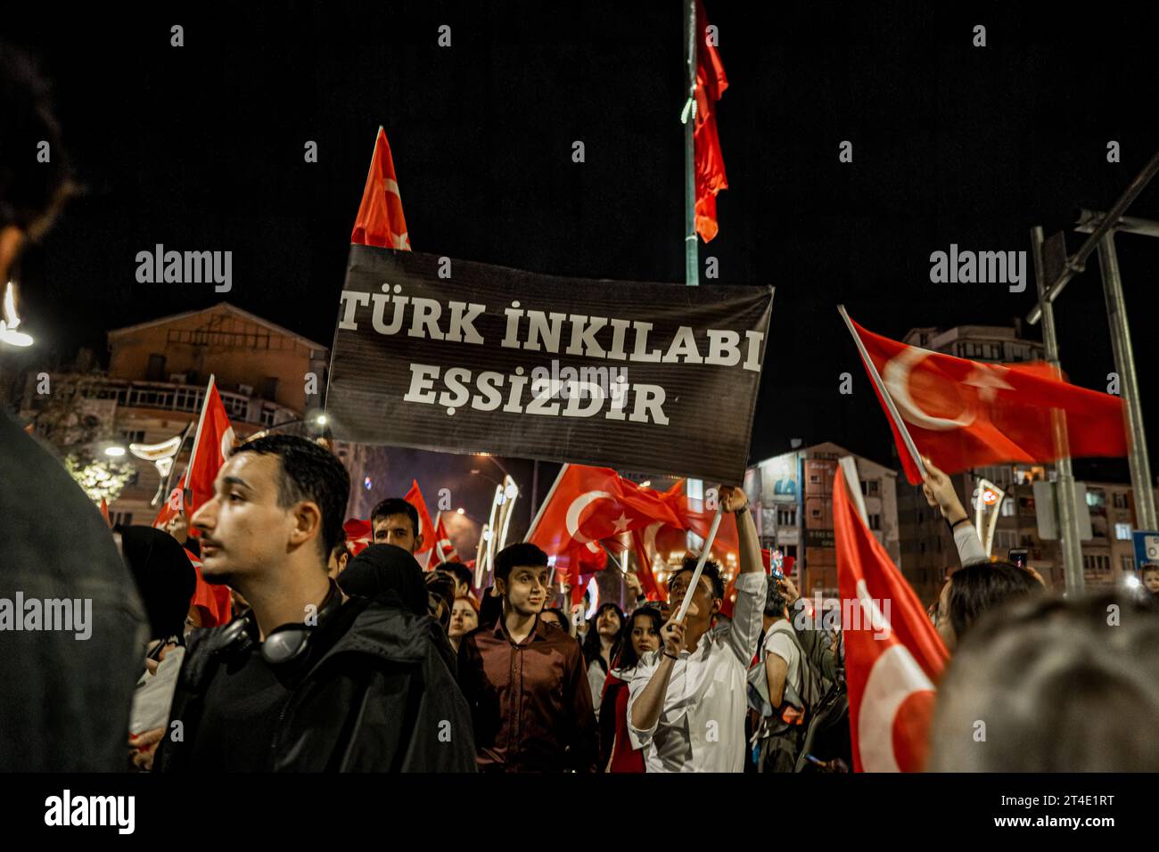 Citizens march with a banner saying 'Turkish revolution is unique ...