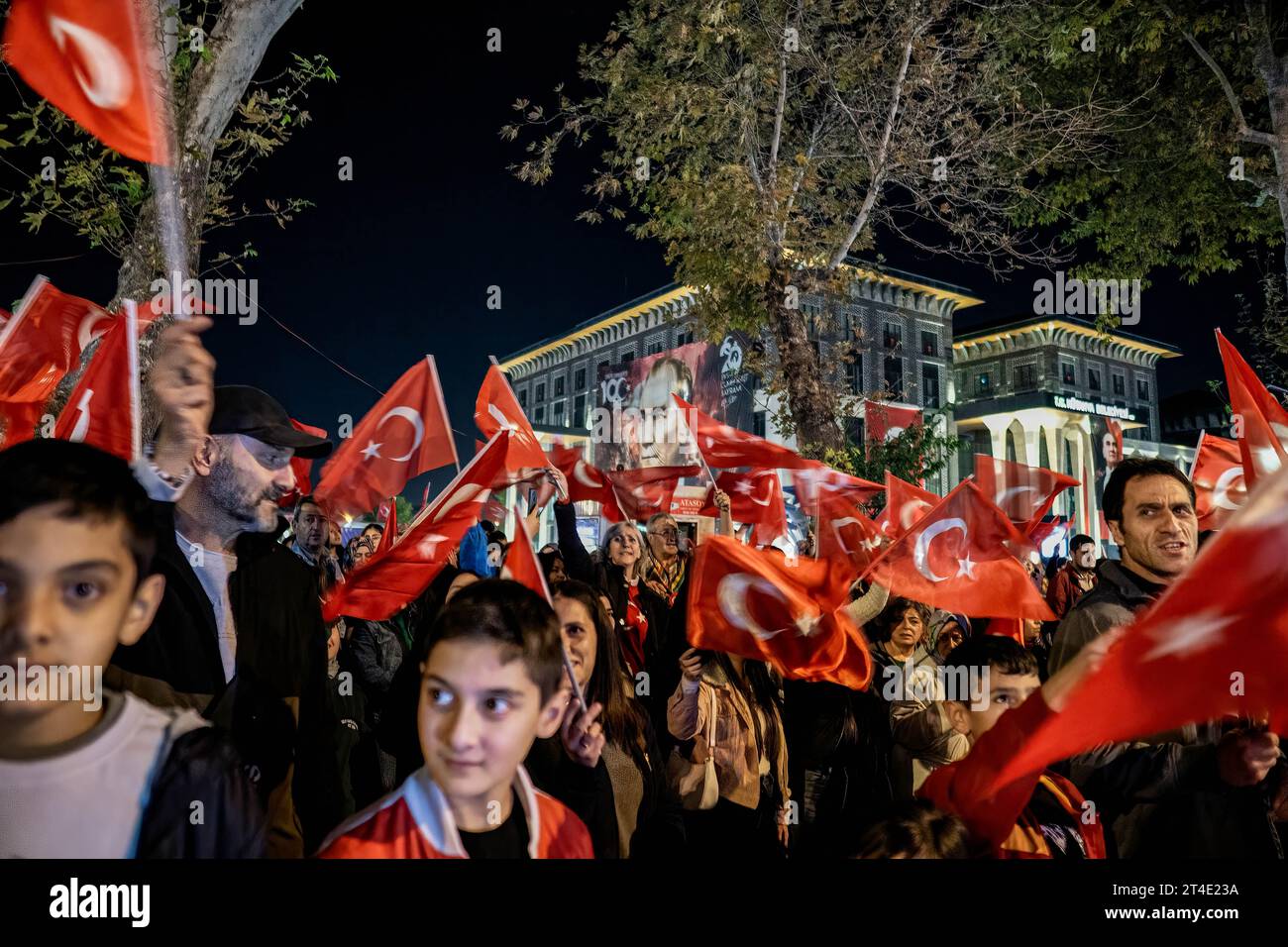 Citizens with Turkish flags march during the parade. The 100th ...