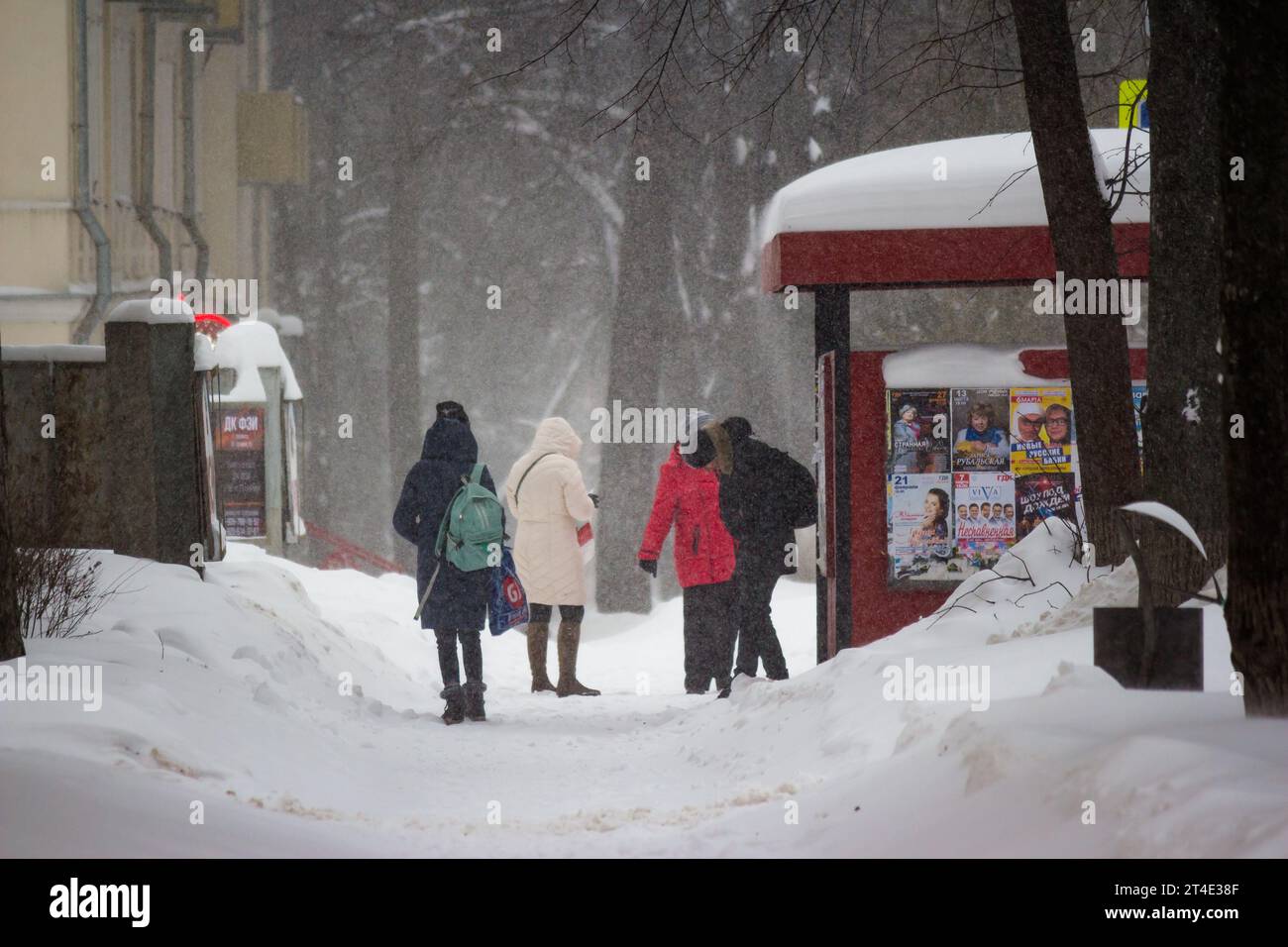 Russia - February 12, 2021: People at a bus stop during bad winter ...
