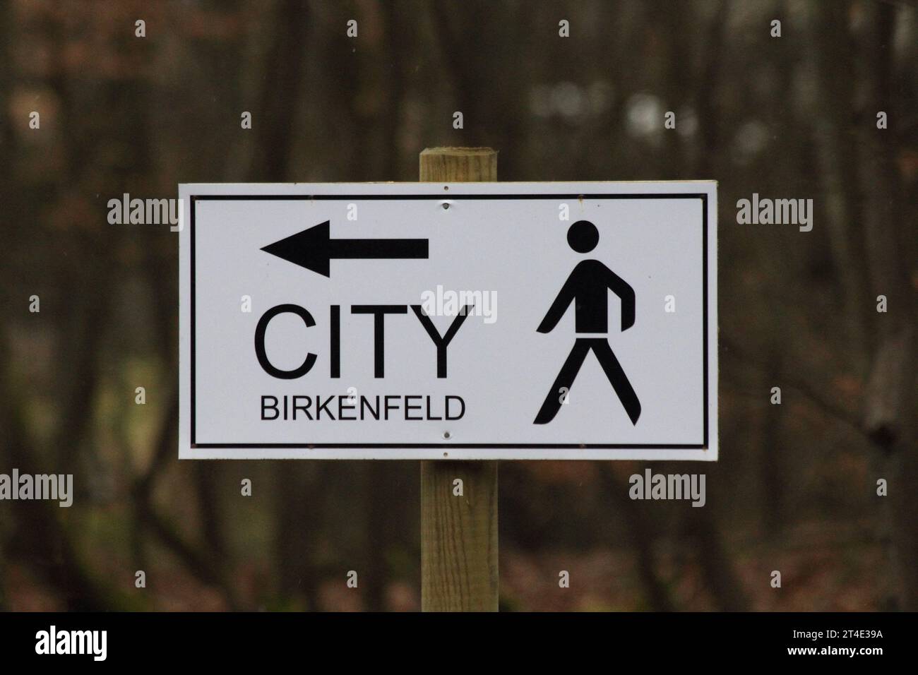 A black and white signboard with inscription, arrow and symbol Stock ...