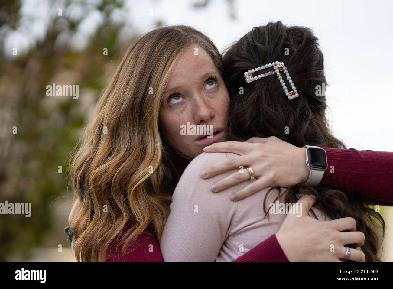 Hypocritical girl hugs a friend but gets bored of being close to her ...