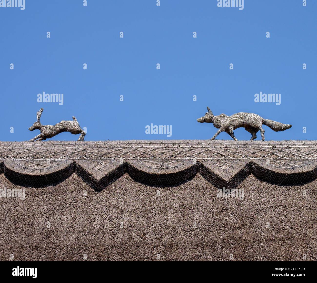 Thatch finial of a fox and hare on a thatched cottage Amberley West ...
