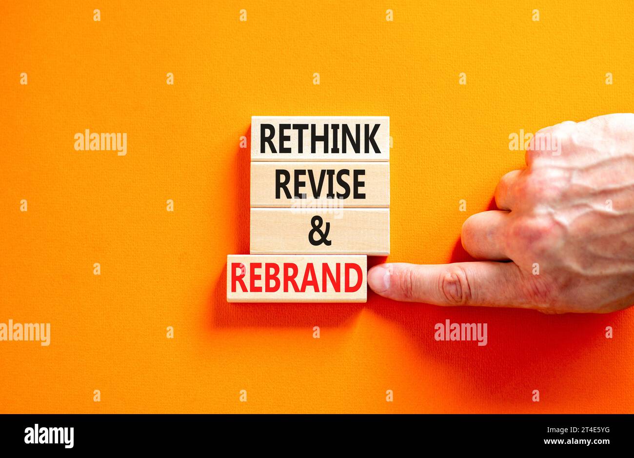 Rethink revise rebrand symbol. Concept word Rethink Revise and Rebrand on beautiful block ...