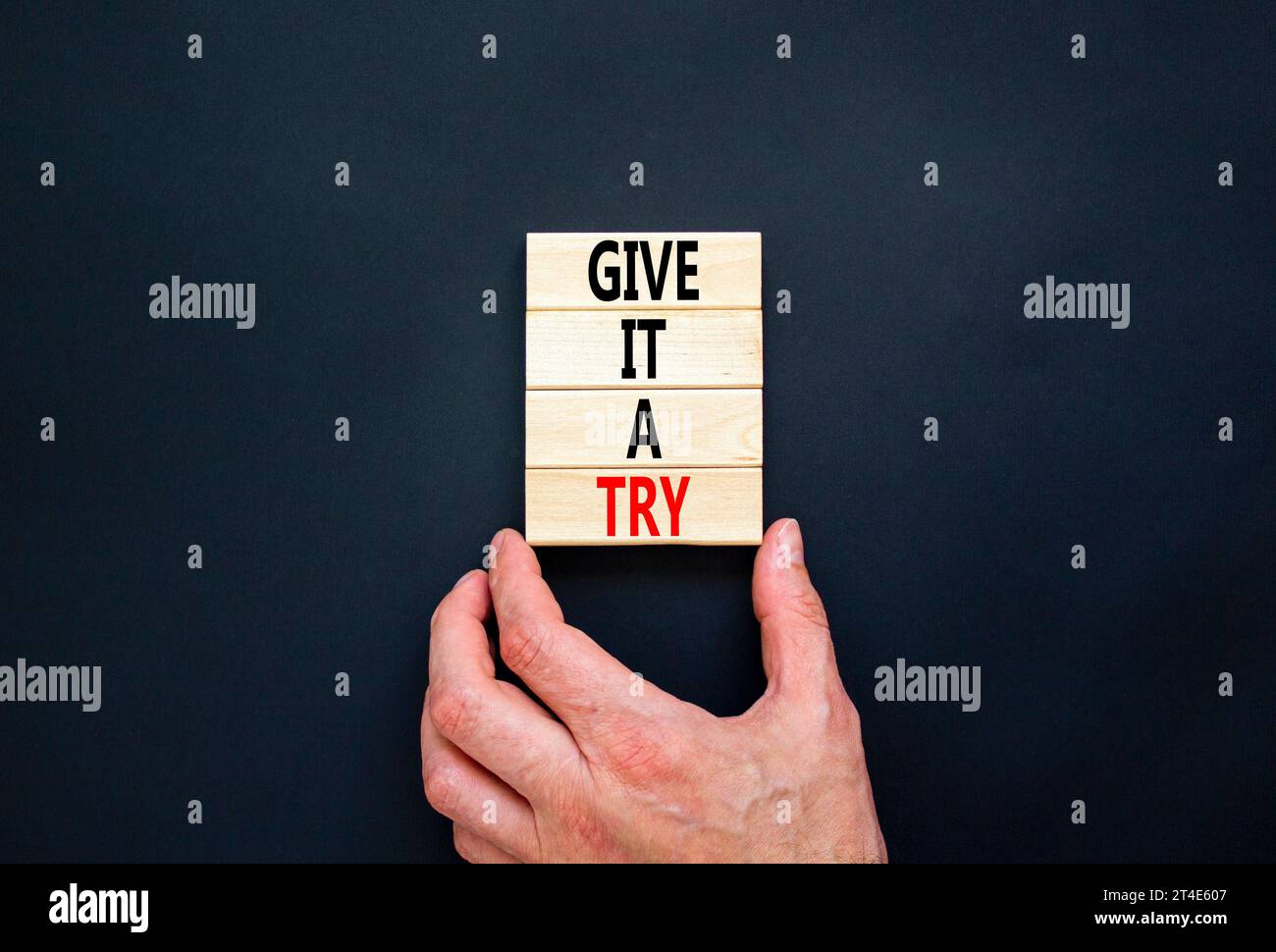 Give it a try symbol. Concept word Give it a try on beautiful wooden block. Beautiful black ...