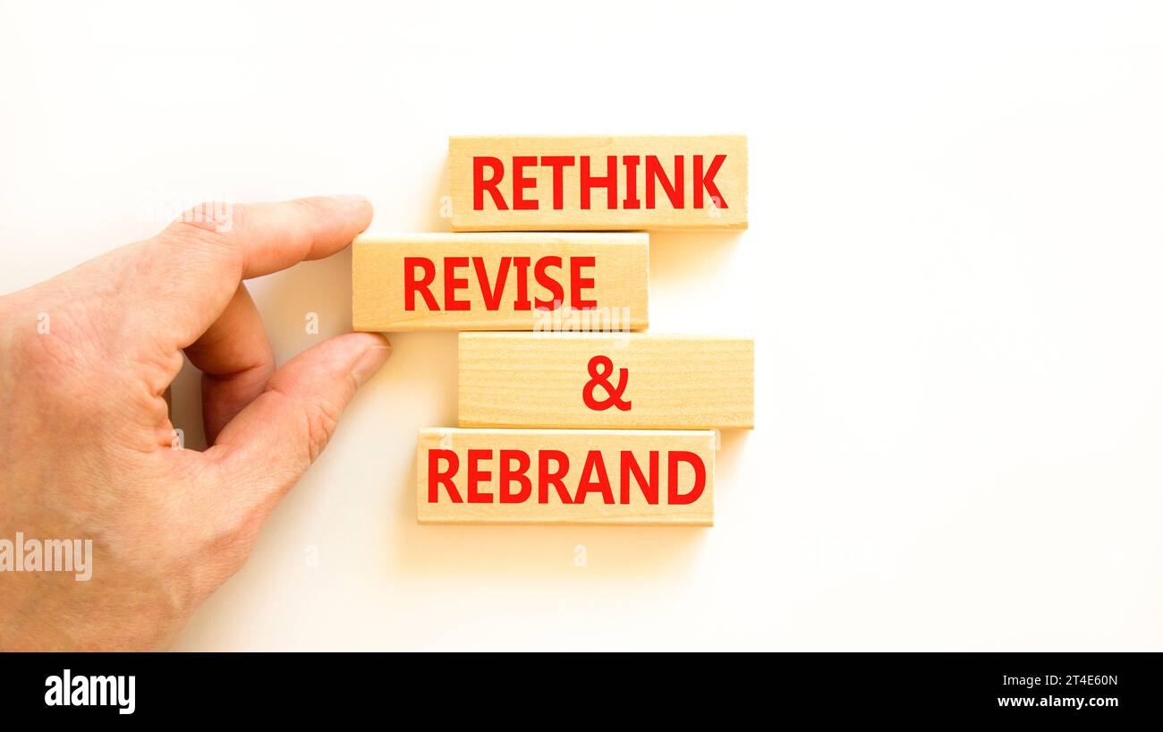 Rethink revise rebrand symbol. Concept word Rethink Revise and Rebrand on beautiful block ...