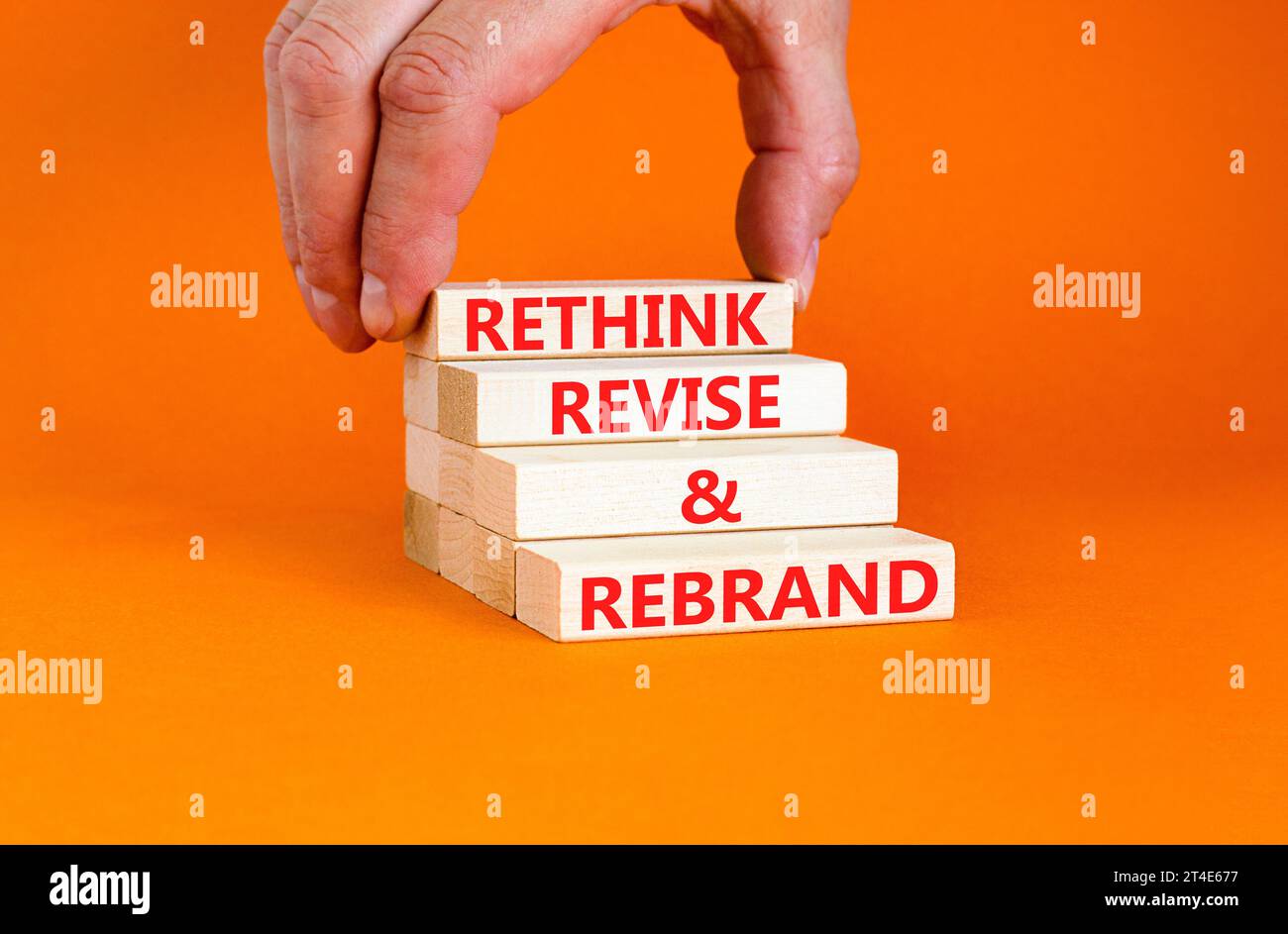 Rethink revise rebrand symbol. Concept word Rethink Revise and Rebrand on beautiful block ...