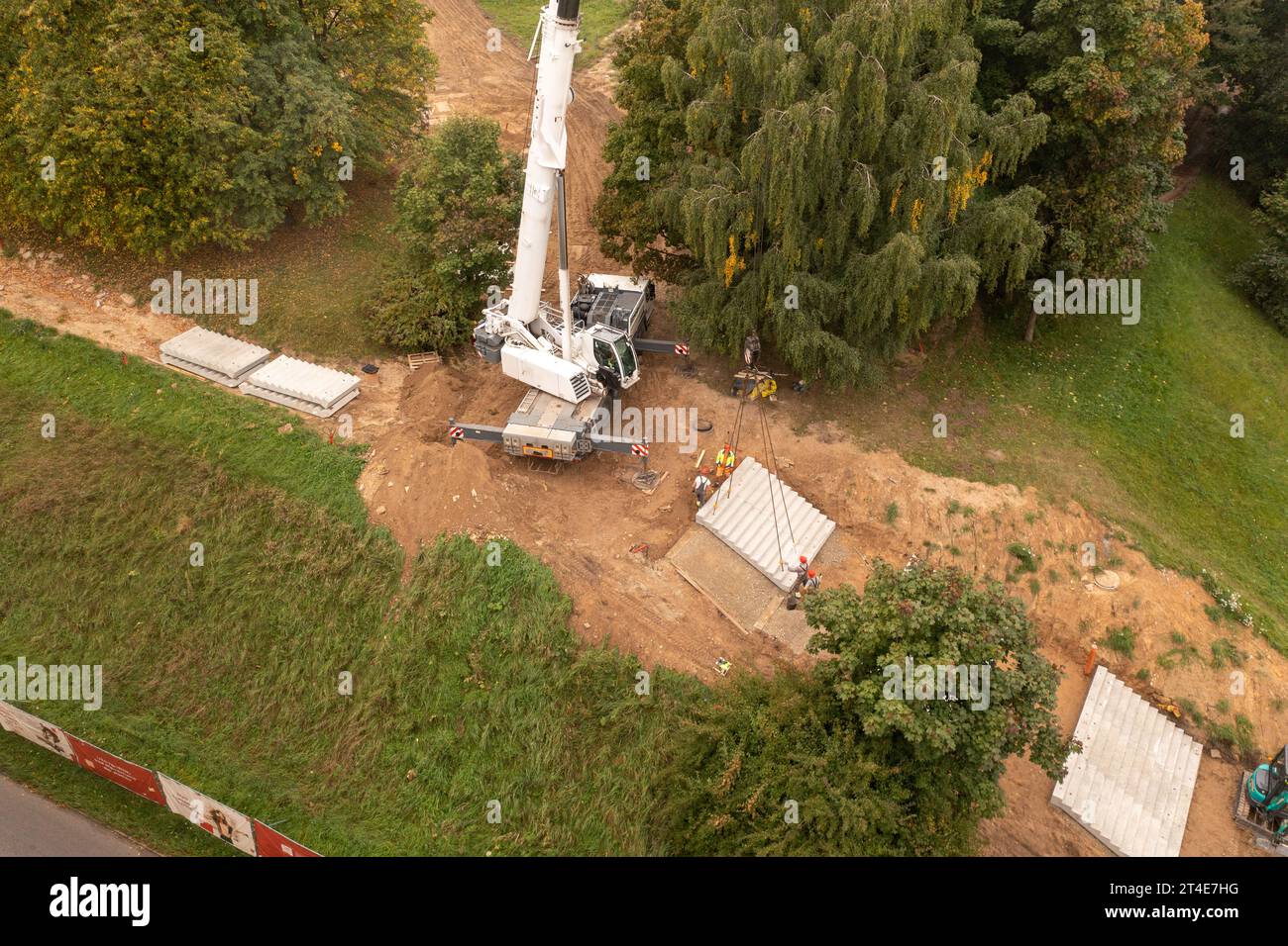 Drone photography of construction workers building staircase in a park ...