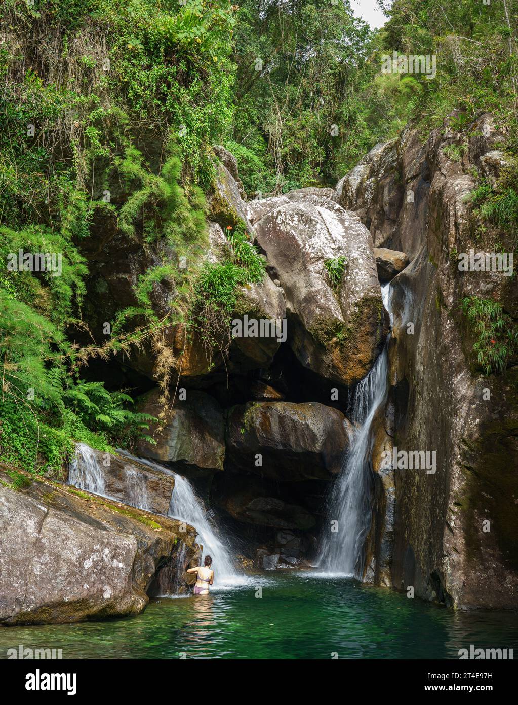 Exploring the Hidden Waterfall Cave in the Tropical Rainforest Stock ...