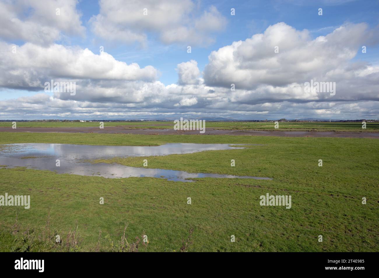 Waterlogged marsh by the River Douglas with a distant view to the ...