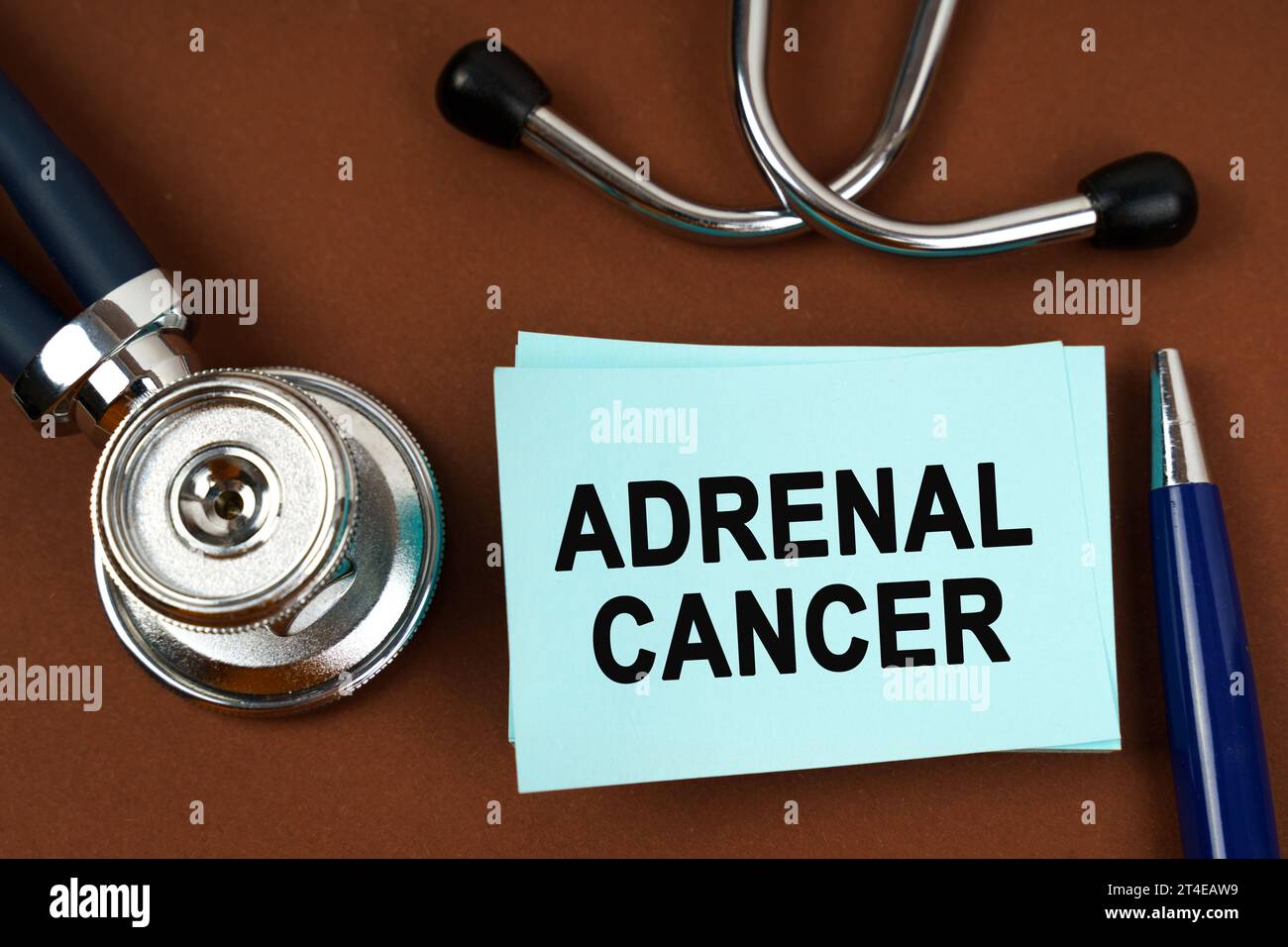 Medical concept. On a brown surface there is a stethoscope, a pen and ...