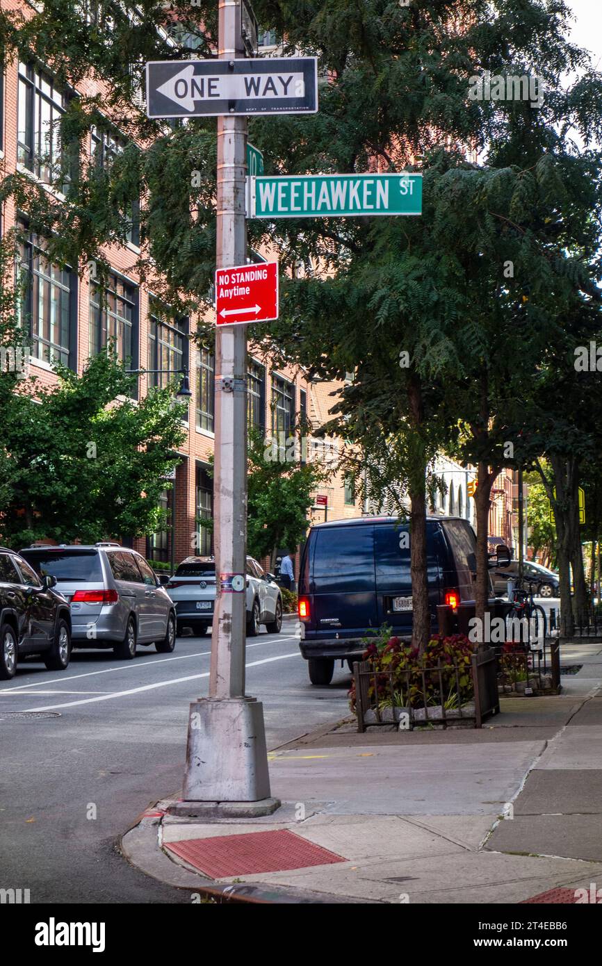 Street sign on the corner of W.10 St and Weehawken St, a one block long ...