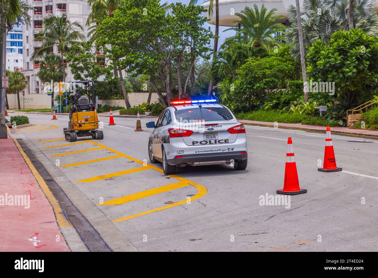 View of police car with its roof lights on standing on one of streets ...