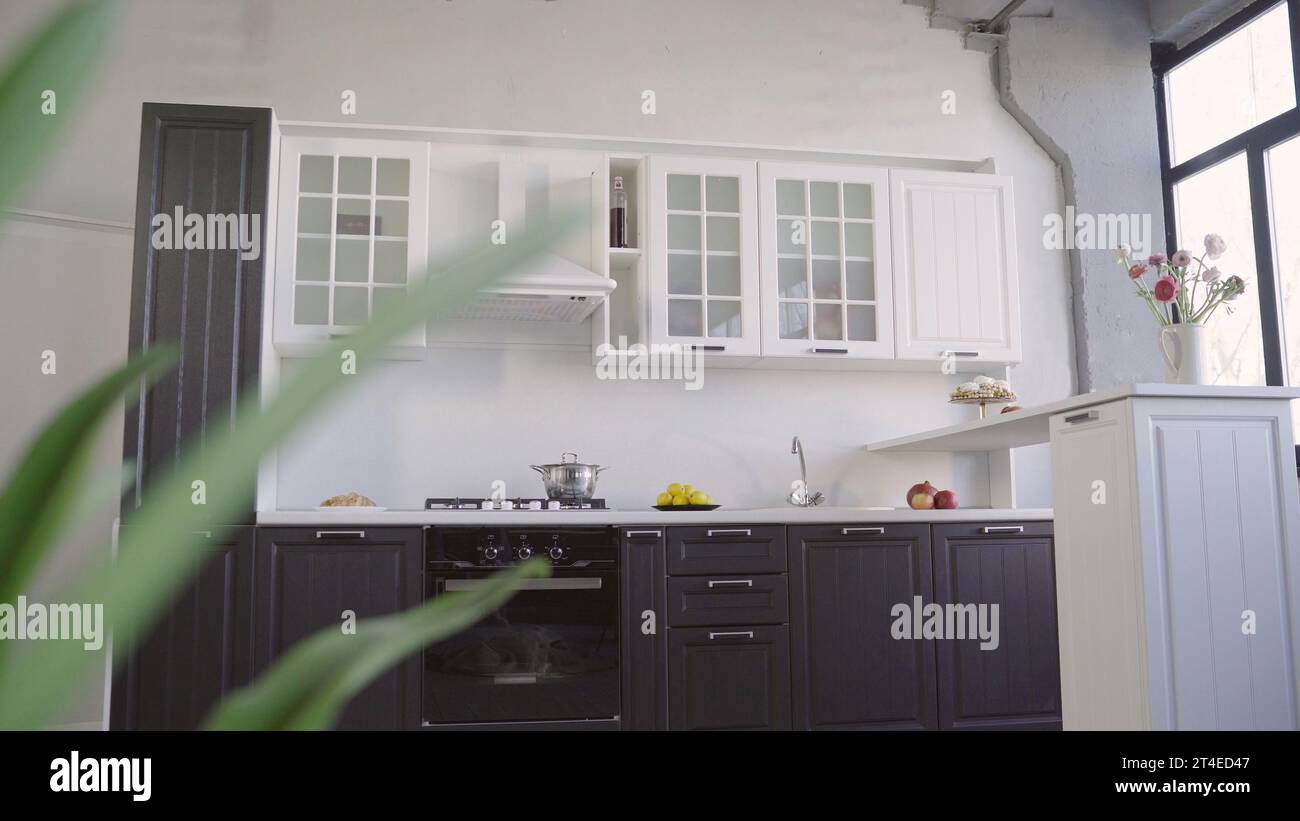 Modern kitchen interior. Rich, white and black set. Beautiful, modern ...
