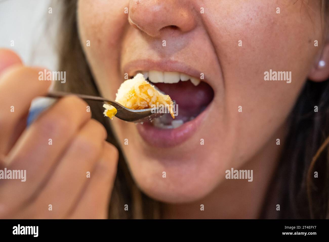Woman eats food. Woman eats cheesecake. Close shot of girl eating cake ...