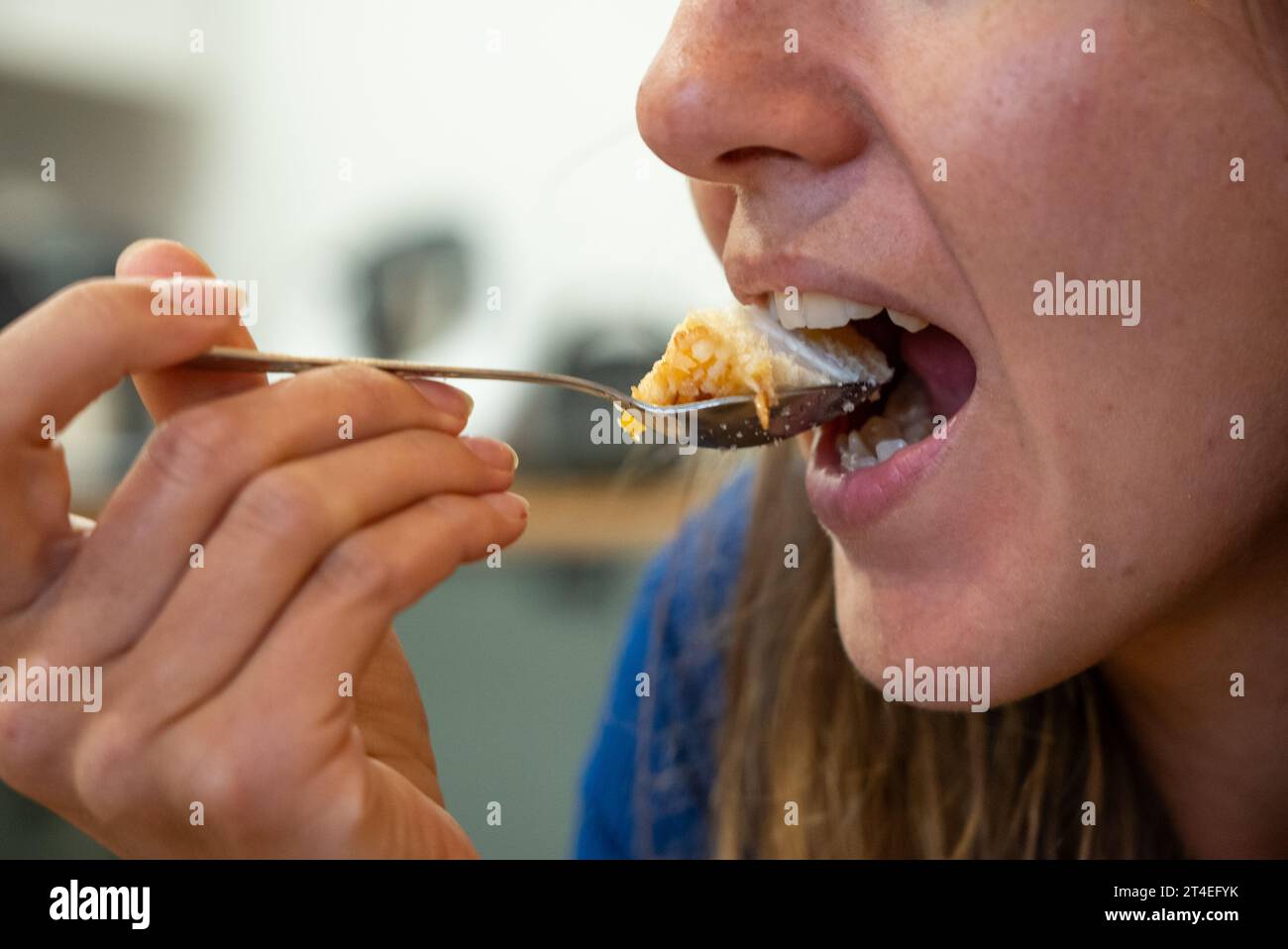Woman eats food. Woman eats cheesecake. Close shot of girl eating cake ...