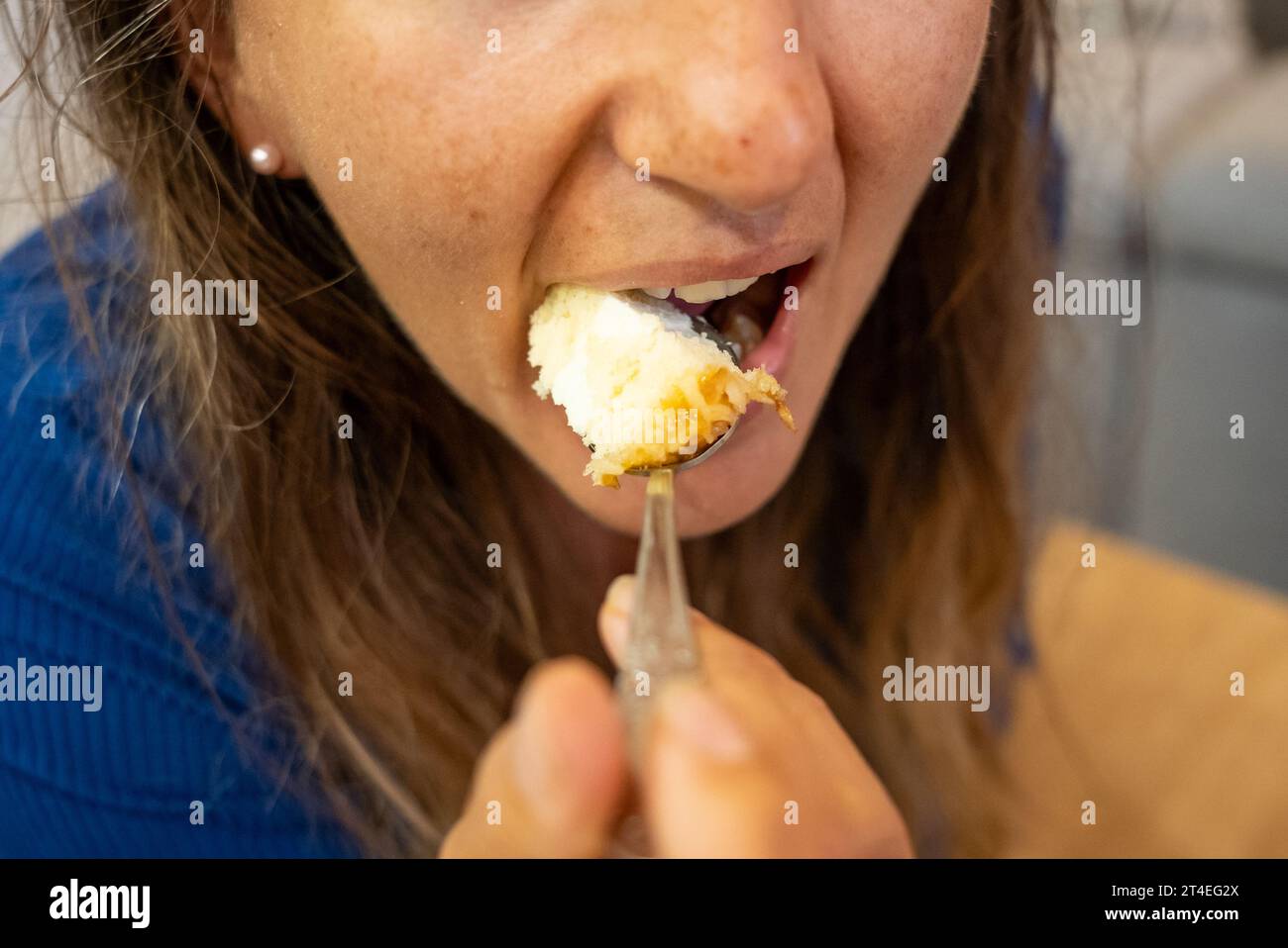 Woman eats food. Woman eats cheesecake. Close shot of girl eating cake ...