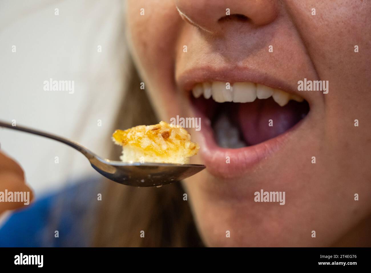 Woman eats food. Woman eats cheesecake. Close shot of girl eating cake ...