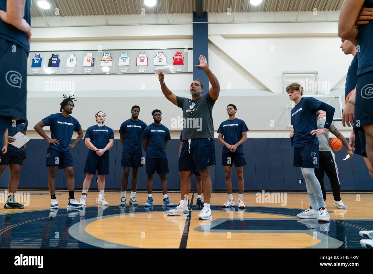 Georgetown NCAA college basketball head coach Ed Cooley, center, speaks ...