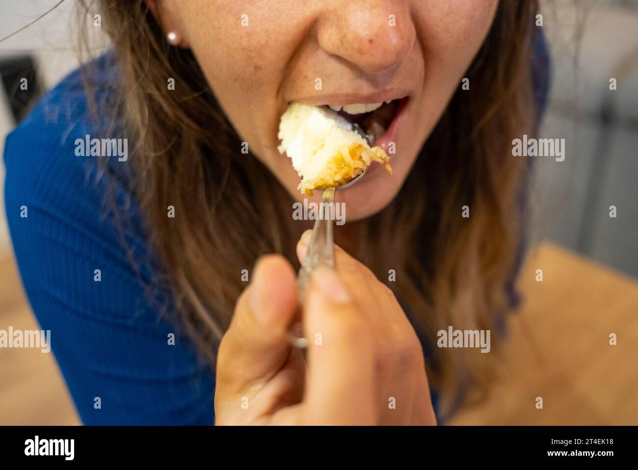 Woman eats food. Woman eats cheesecake. Close shot of girl eating cake ...