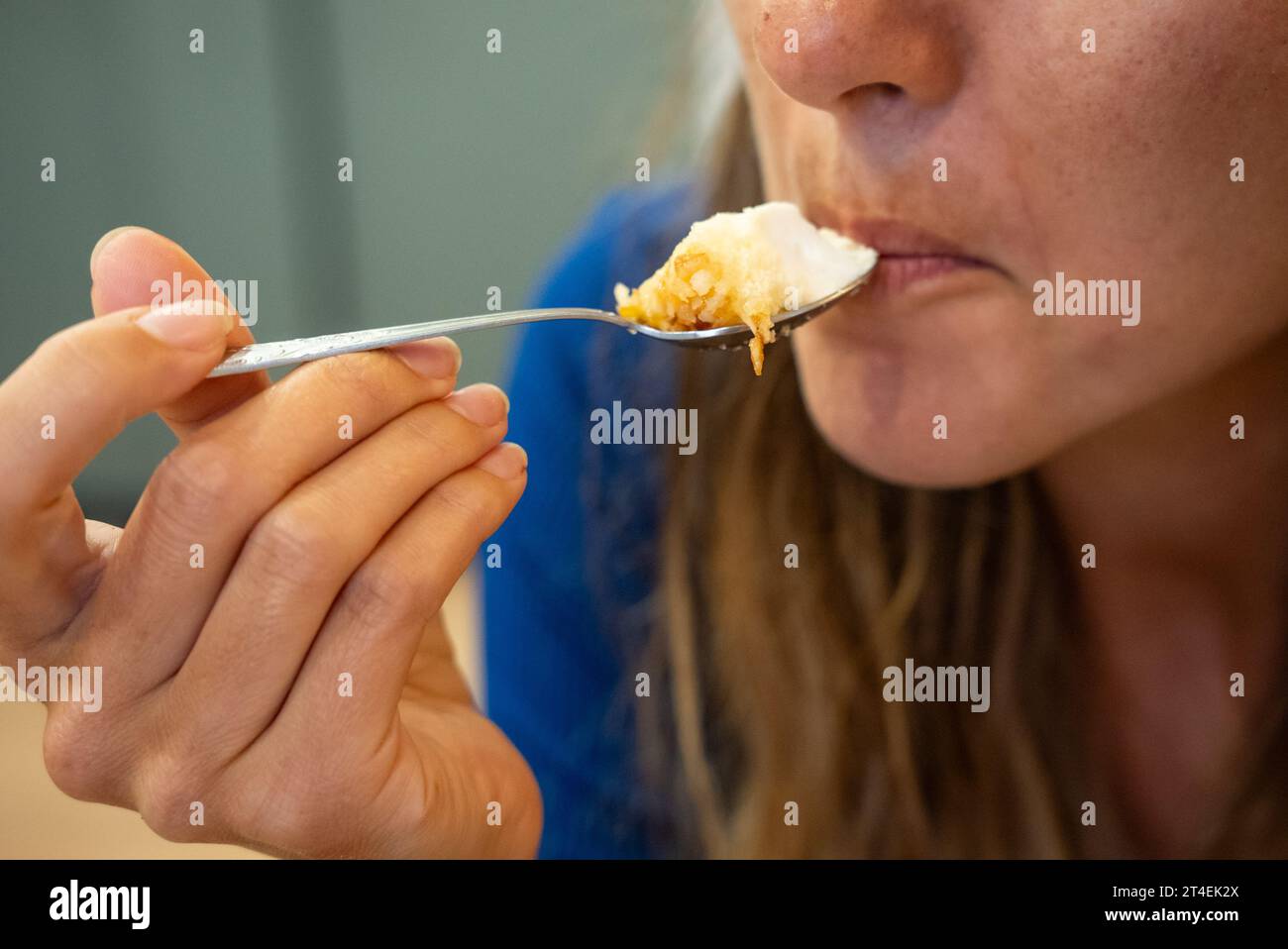 Woman eats food. Woman eats cheesecake. Close shot of girl eating cake ...