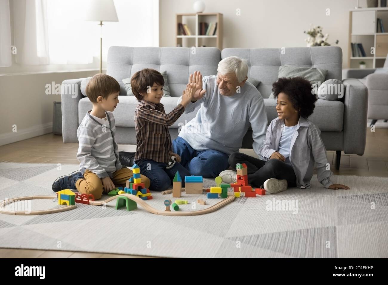 Great Grandpa Play Wooden Railroad With Little Great Grandsons Stock 0285