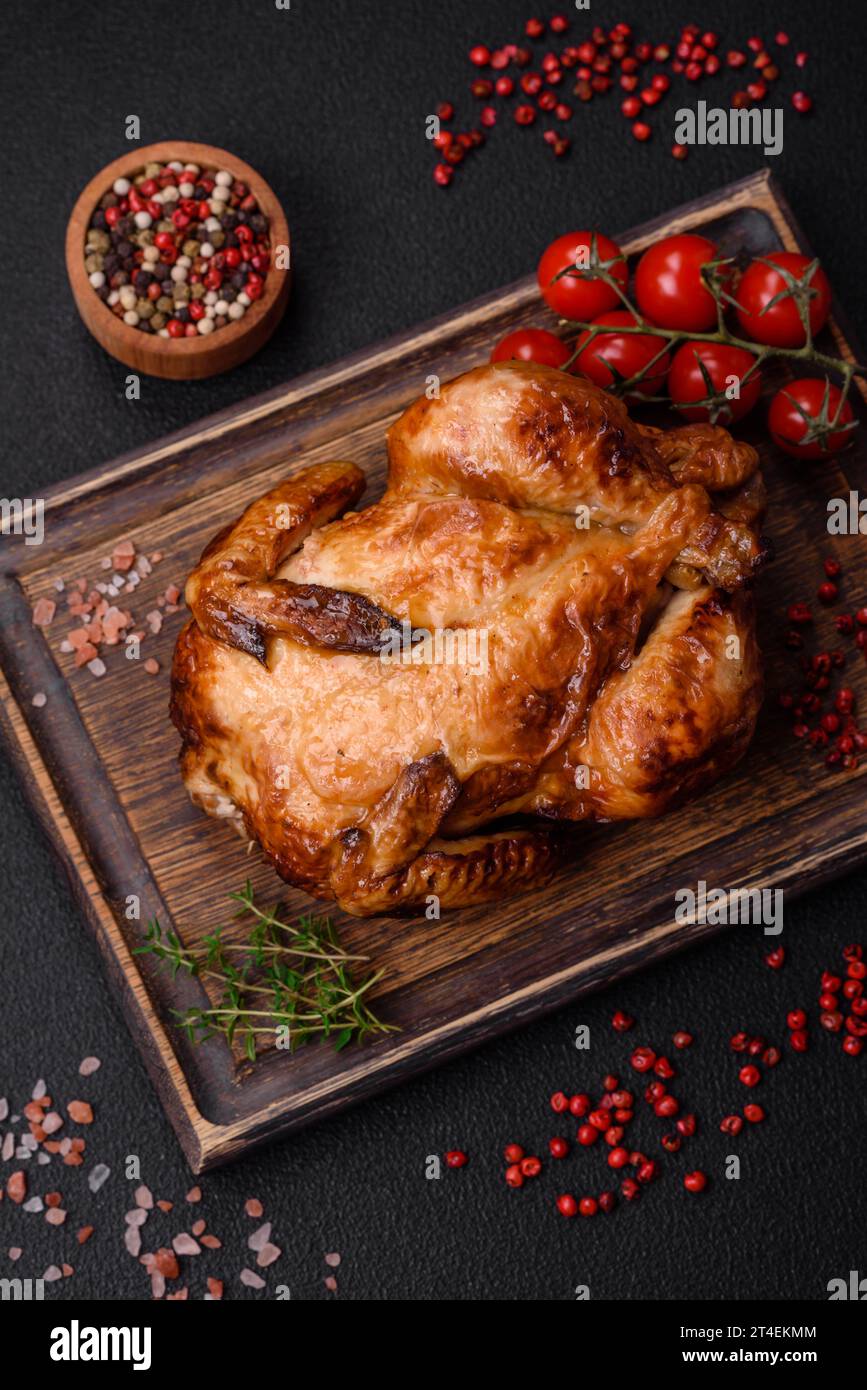 Crispy delicious whole baked chicken with vegetables, salt and spices ...