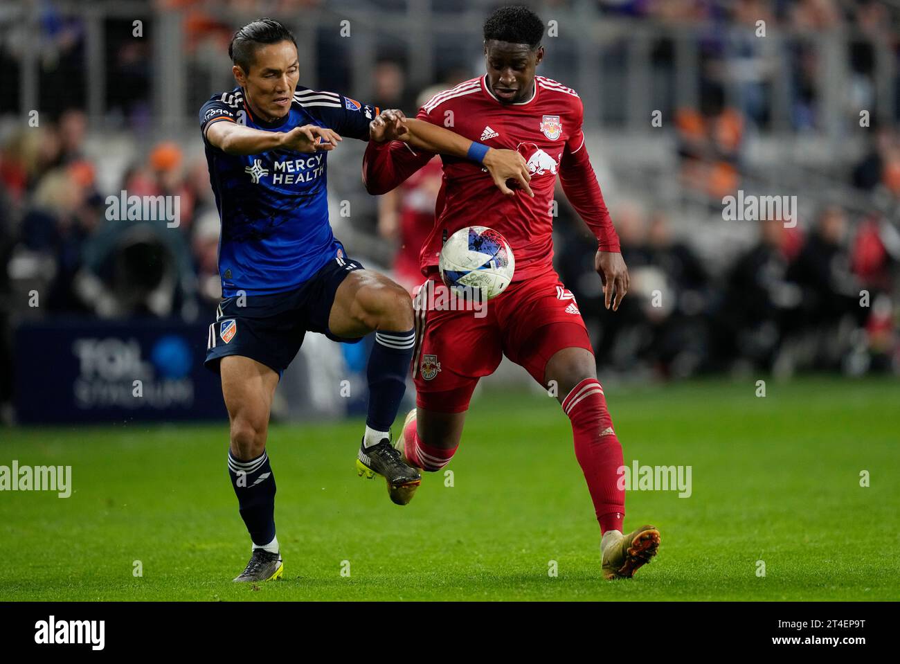 FC Cincinnati forward Yuya Kubo, left, and New York Red Bulls defender ...