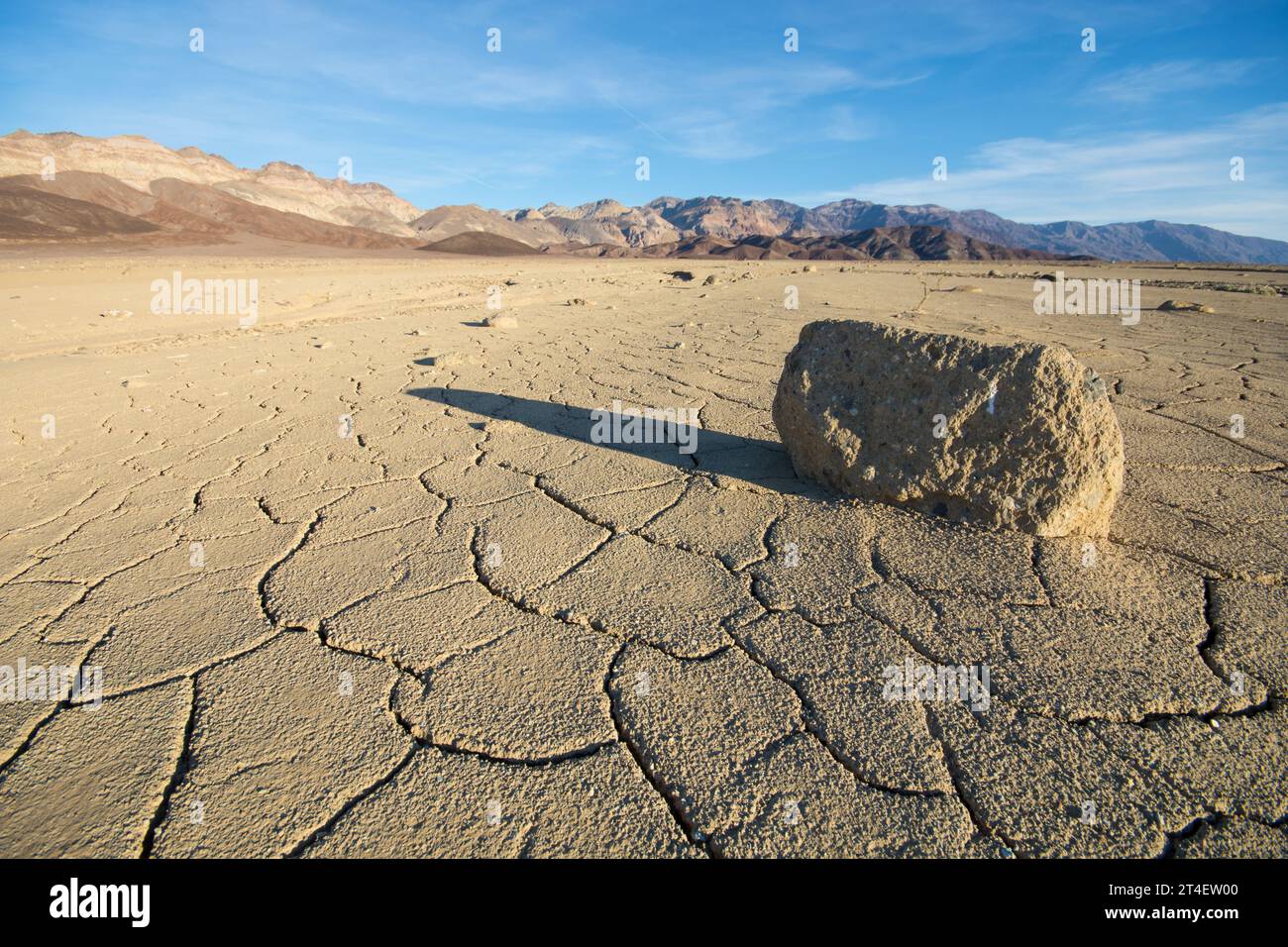 Stone on cracked ground at Death Valley National Park Stock Photo - Alamy