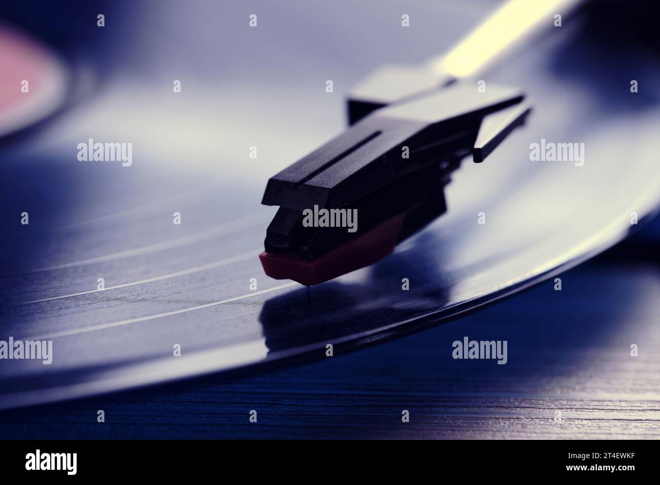 Classic vinyl record player closeup with contoured daylight from window ...