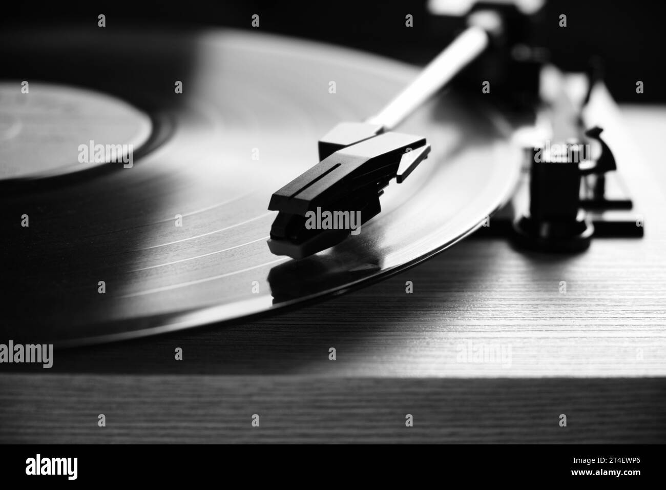 Classic vinyl record player closeup with contoured daylight from window ...