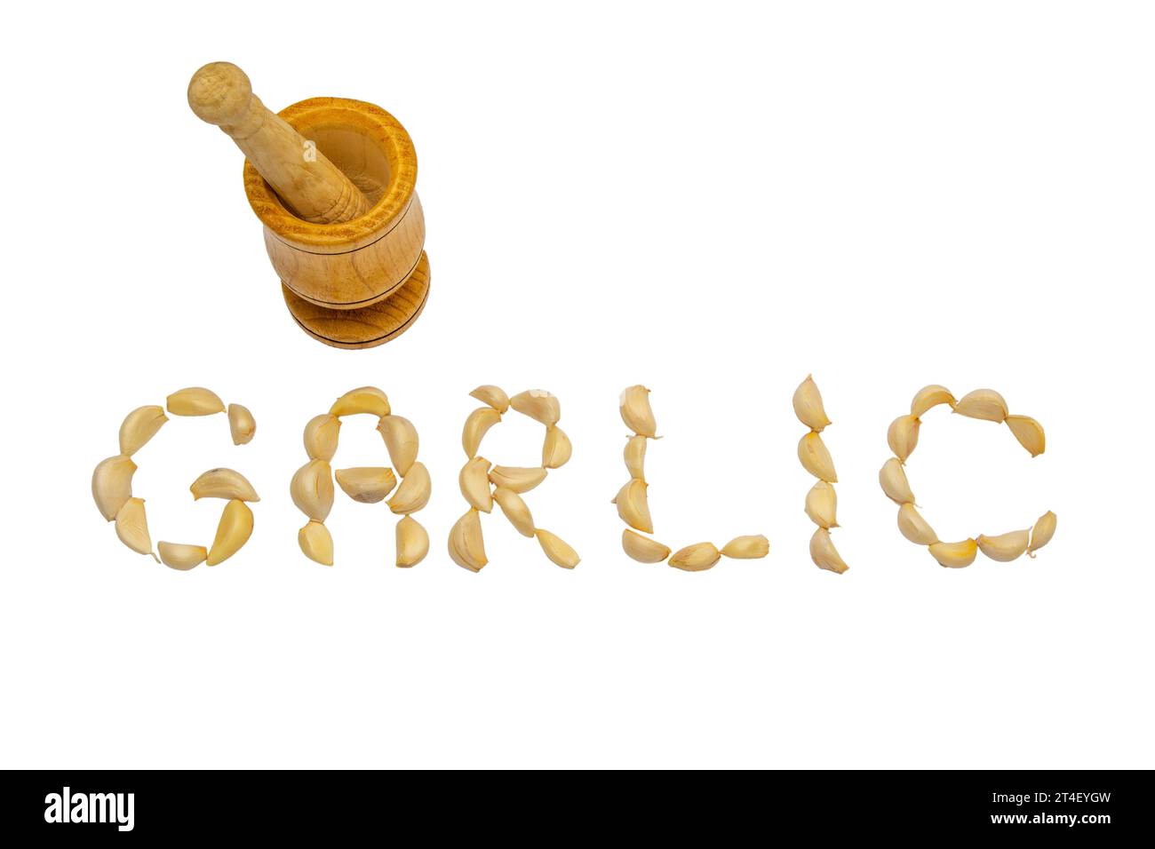 Garlic letters and garlic press written with garlic grains on a white ...